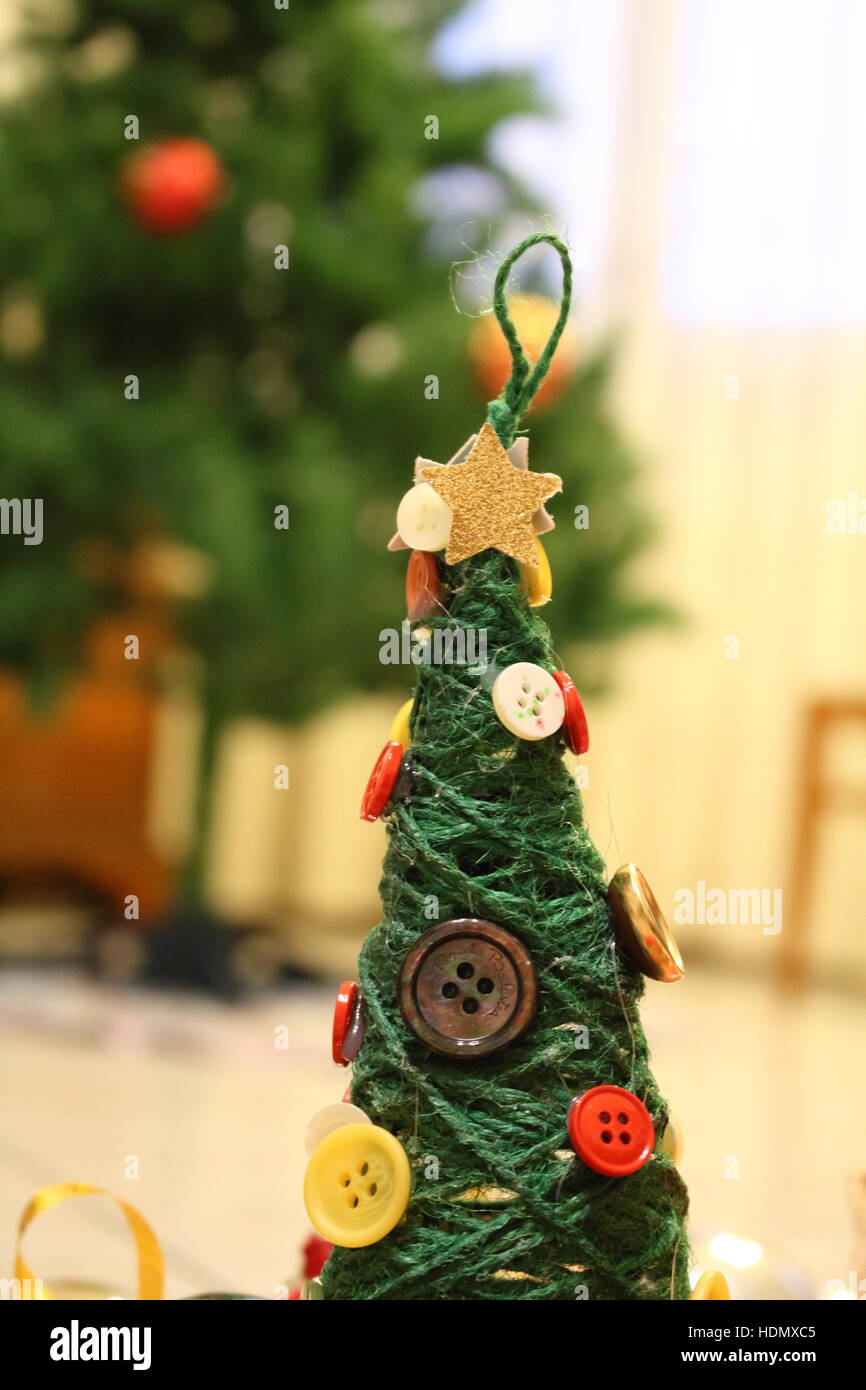 the Christmas tree little boy with the big one in the background Stock ...