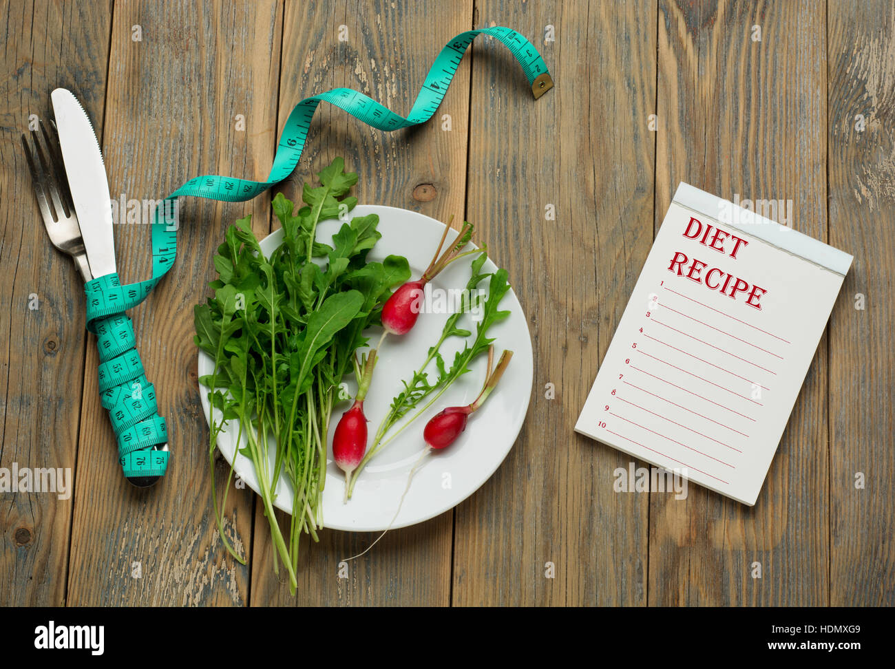 Diet plan, menu or program, tape measure, diet food on white plate ...