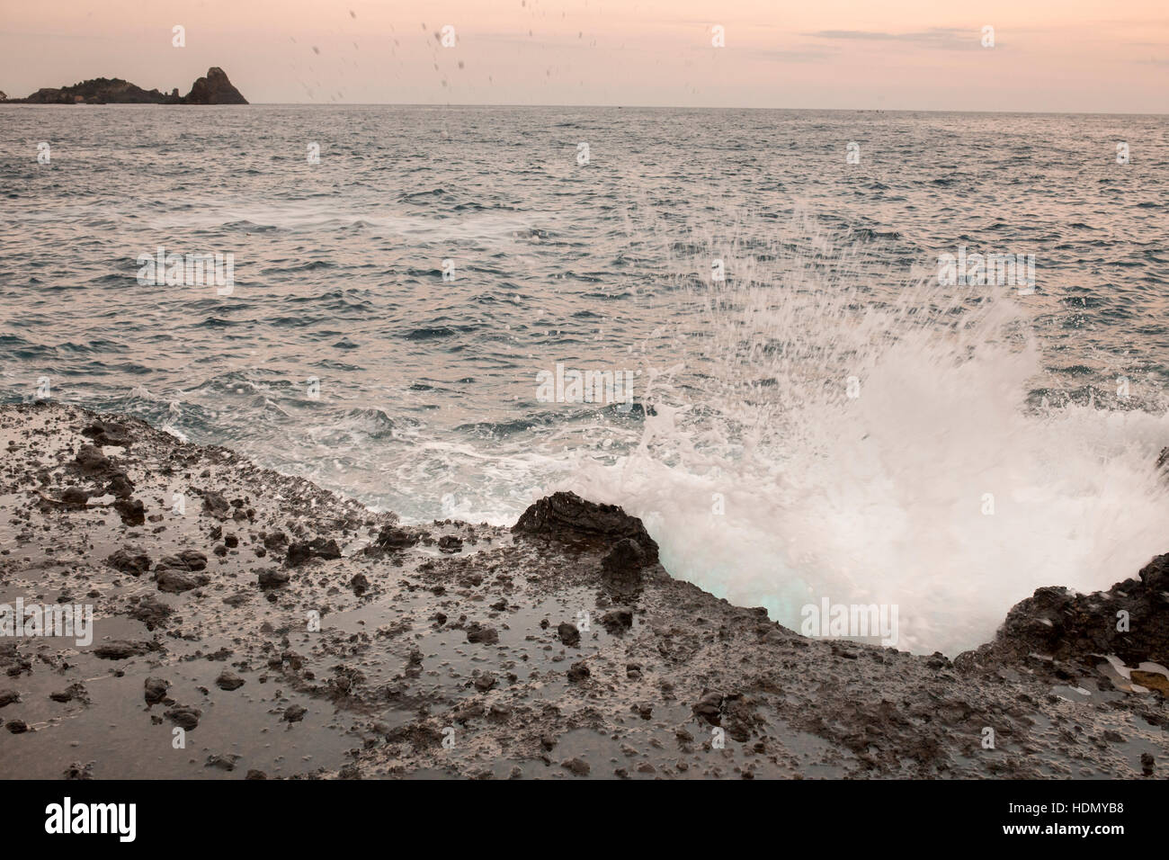 Deep blue sea waves splashing volcanic rocks, Catania, Sicily coast ...
