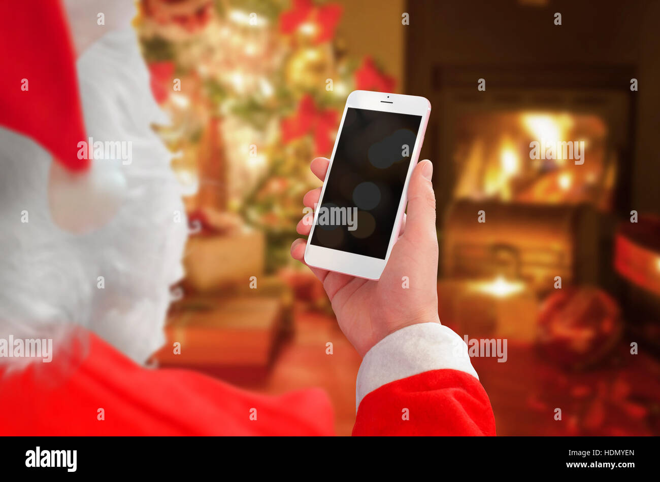 Santa Claus hold white smart phone with blank screen for mockup ...