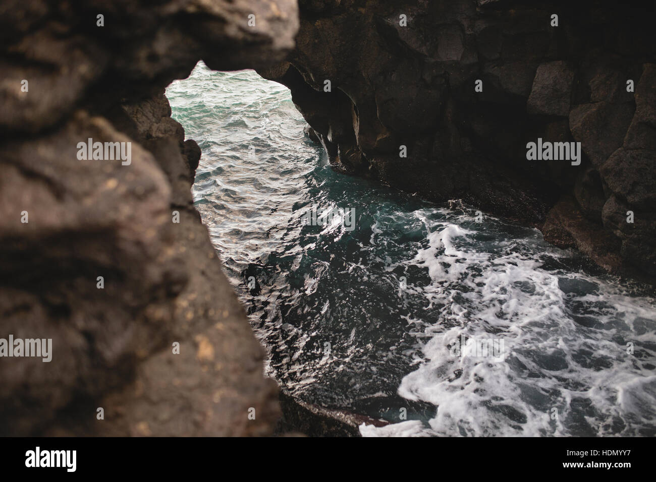 Deep blue sea waves splashing volcanic rocks, Catania, Sicily coast ...