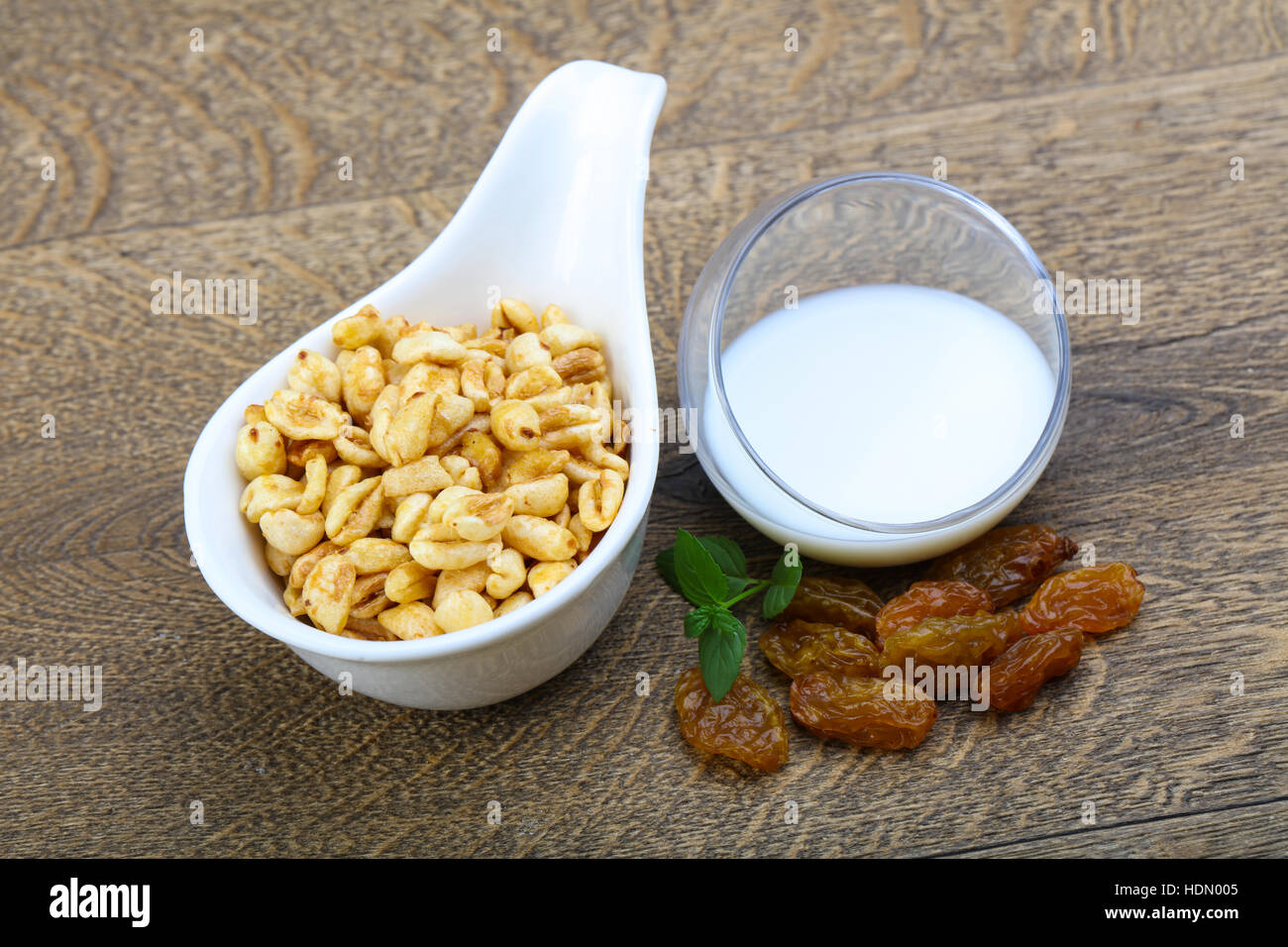 Rise flakes with milk, raisin and mint leaves Stock Photo - Alamy