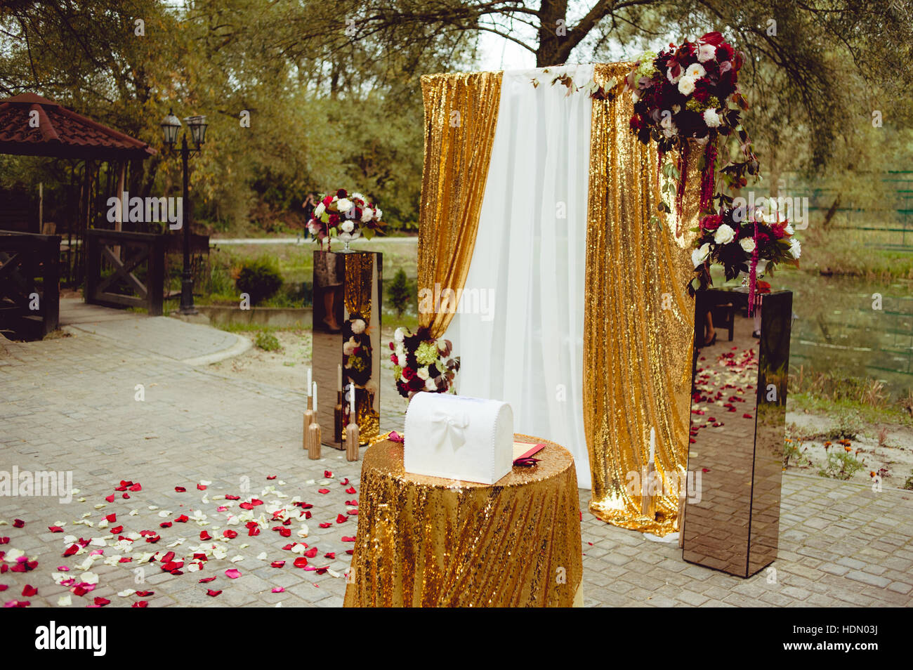 Wedding Arch in gold tones Stock Photo - Alamy