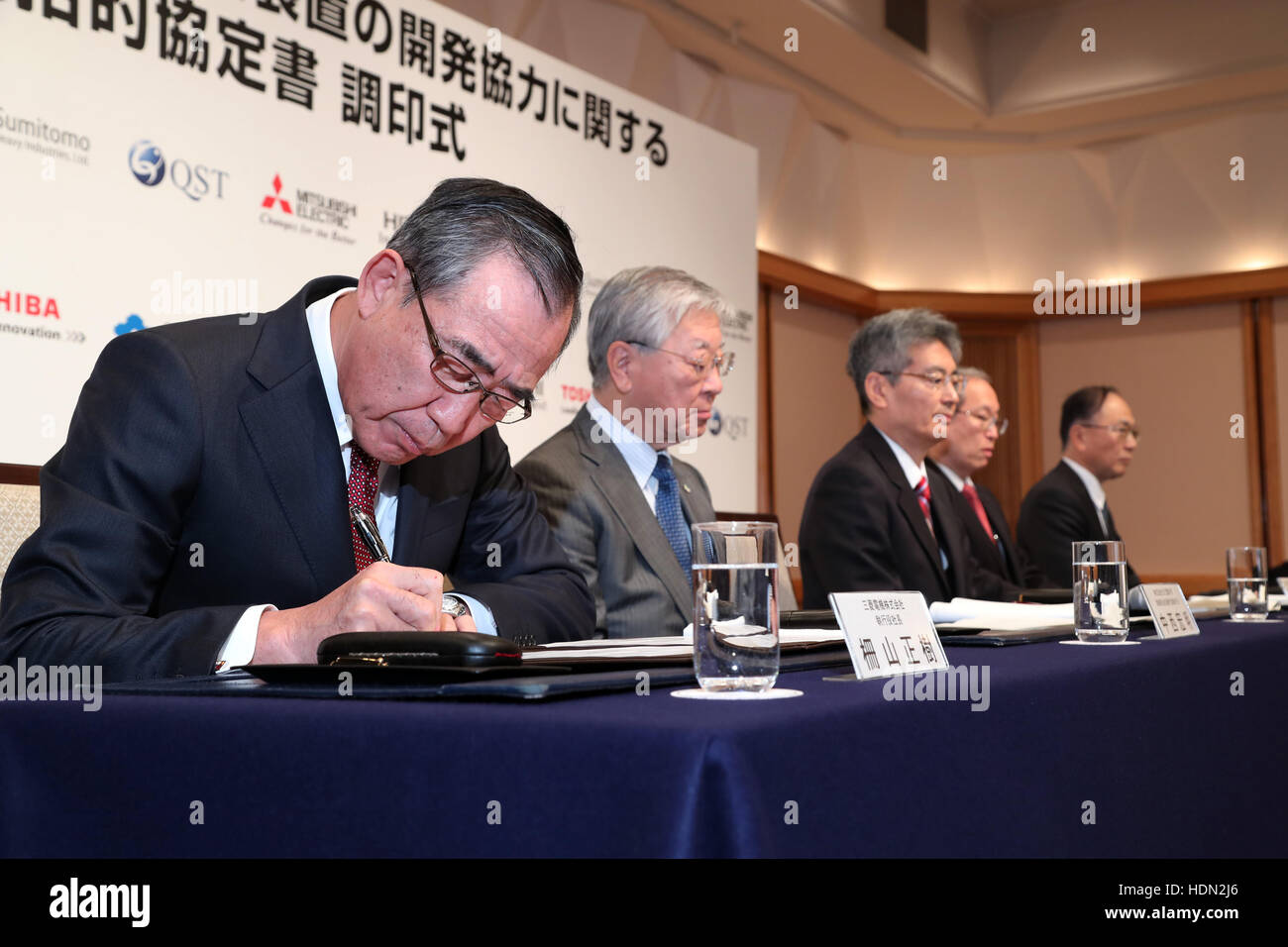 Tokyo, Japan. 13th Dec, 2016. (L-R) Mitsubishi Electric president ...