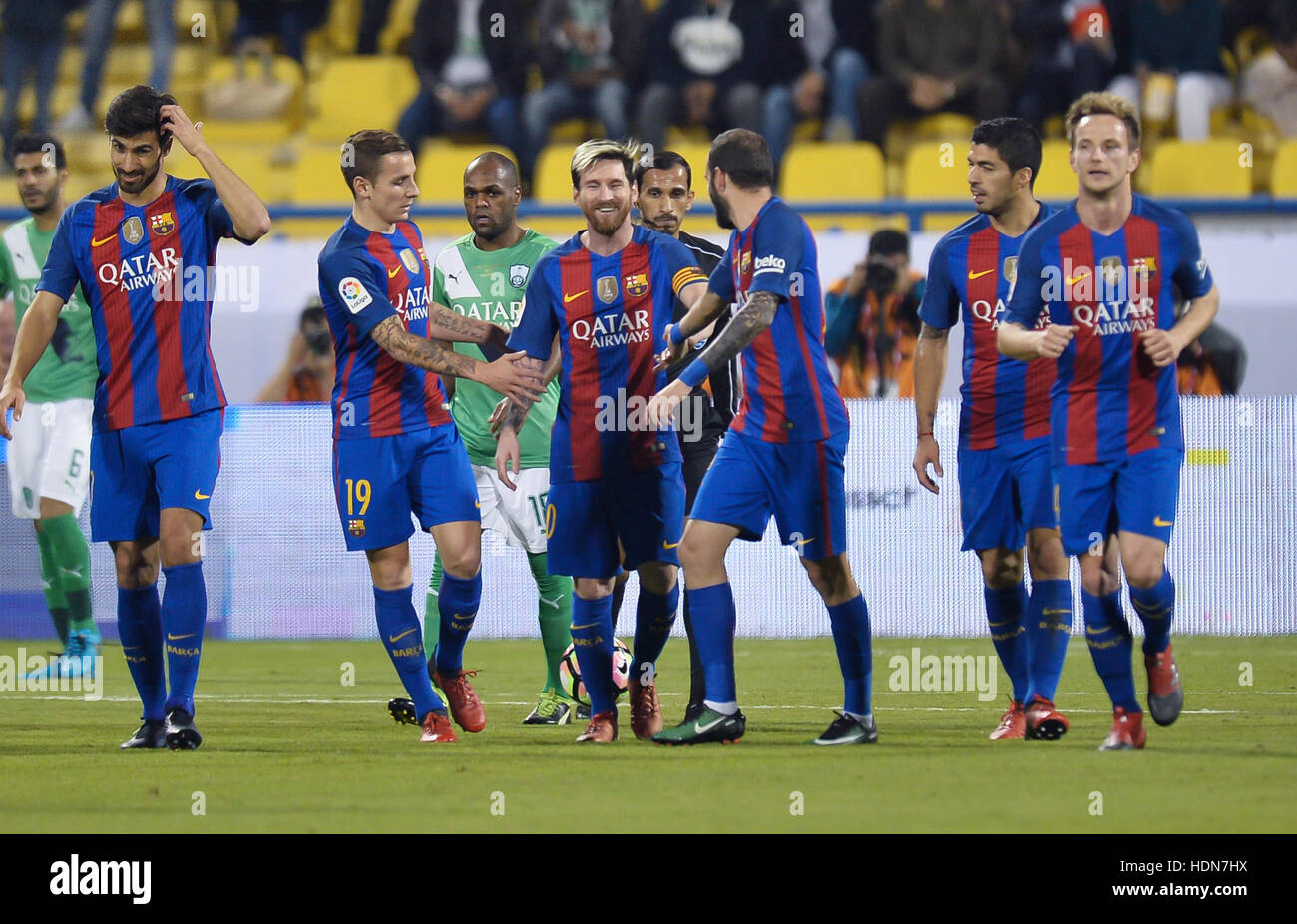 Doha, Qatar. 13th Dec, 2016. Barcelona's Lionel Messi (C) celebrates ...