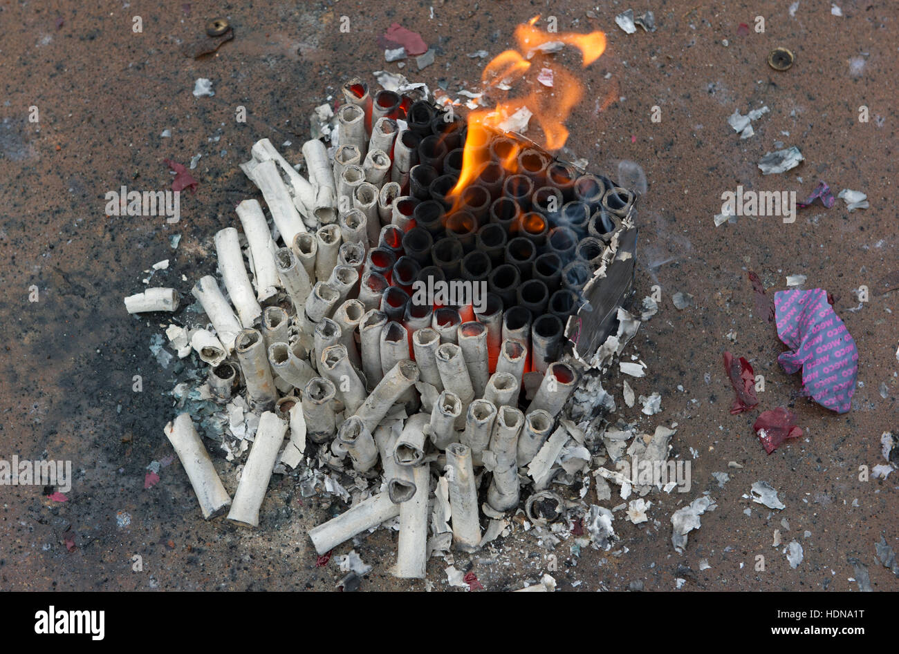 A used battery of firecrackers burns out during a press call on the ...