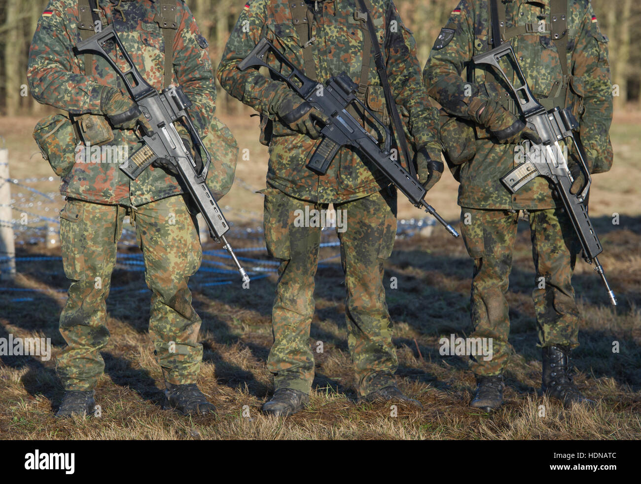 Soldiers in their basic training hold assault rifles of the type G36 on ...