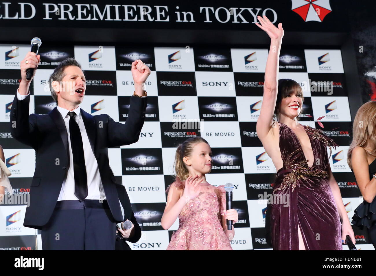 Director Paul W. S. Anderson, his wife and actress Milla Jovovich and ...