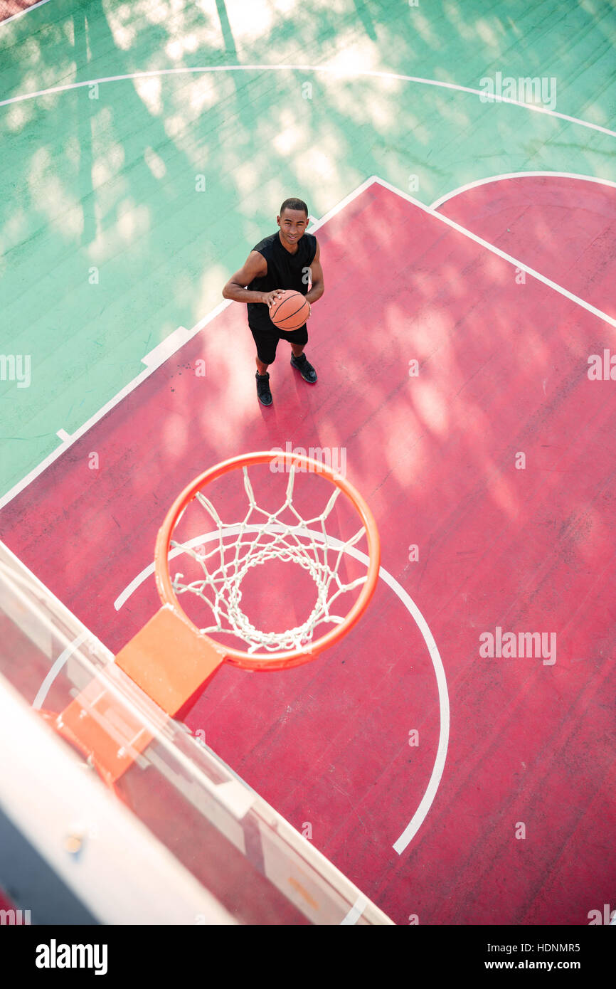 Photo of attractive african basketball player practicing for basketball ...