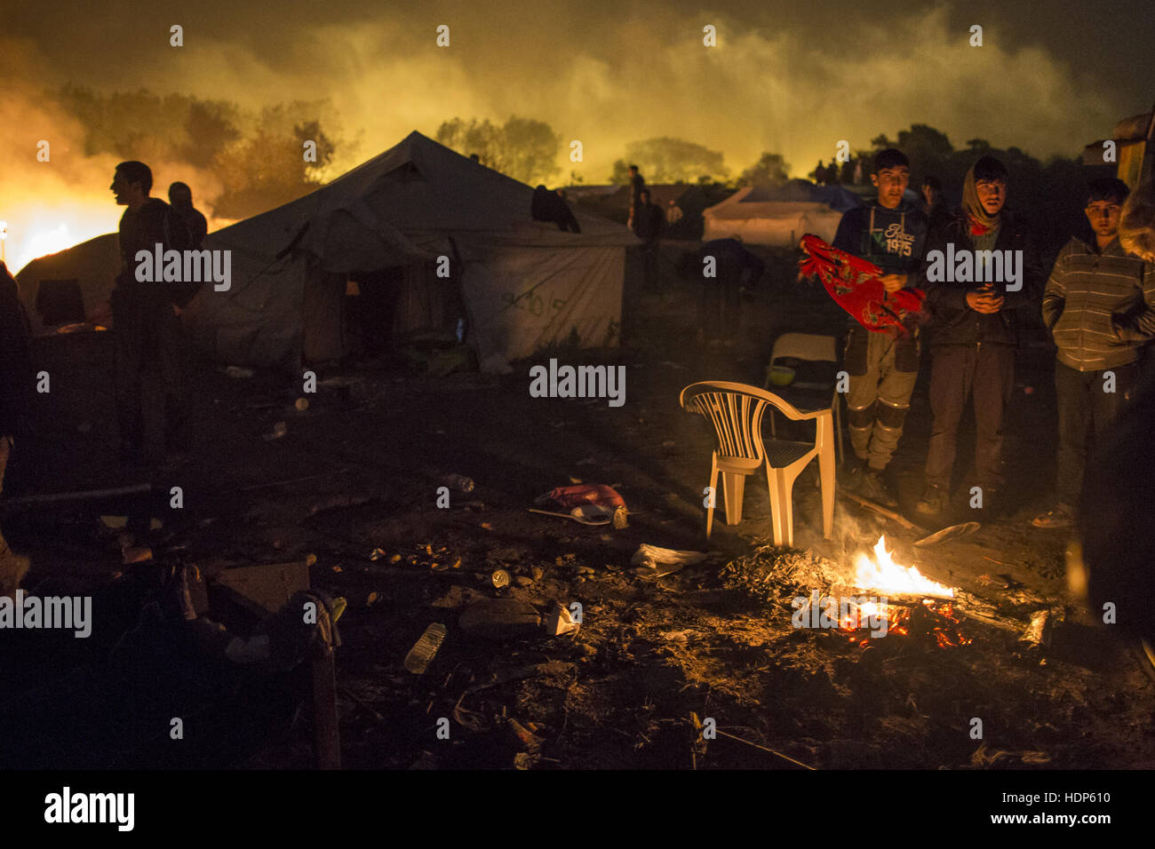 Firefighters in the Calais Jungle putting out fires set alight by ... Firefighters in the Calais Jungle putting out fires set alight by ...