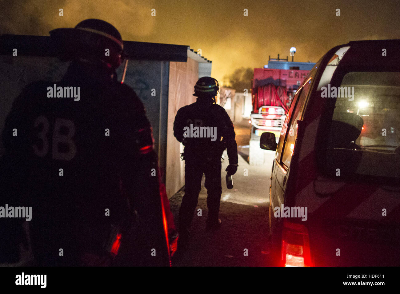 Firefighters in the Calais Jungle putting out fires set alight by ... Firefighters in the Calais Jungle putting out fires set alight by ...