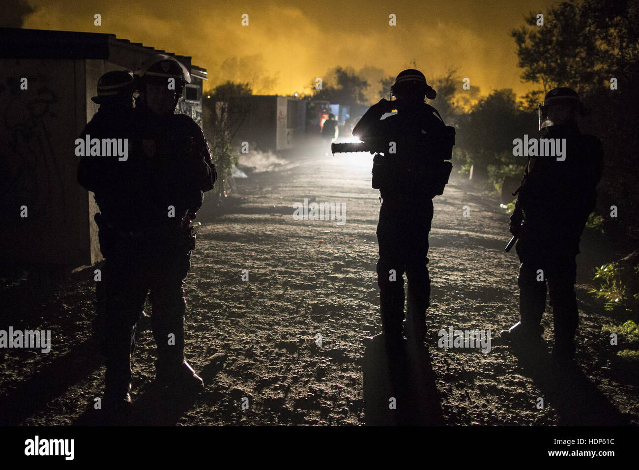 Firefighters in the Calais Jungle putting out fires set alight by ... Firefighters in the Calais Jungle putting out fires set alight by ...