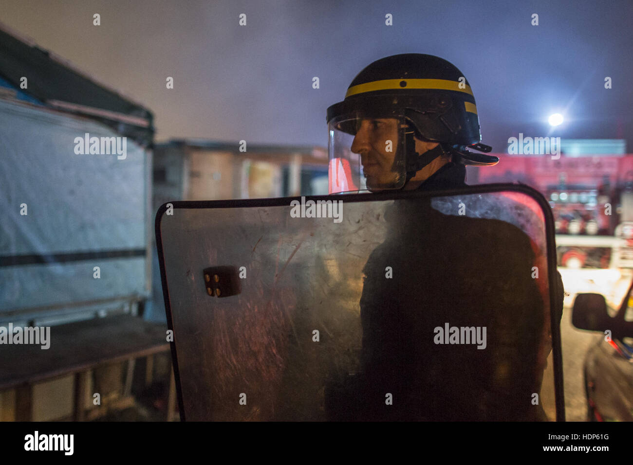 Firefighters in the Calais Jungle putting out fires set alight by ...