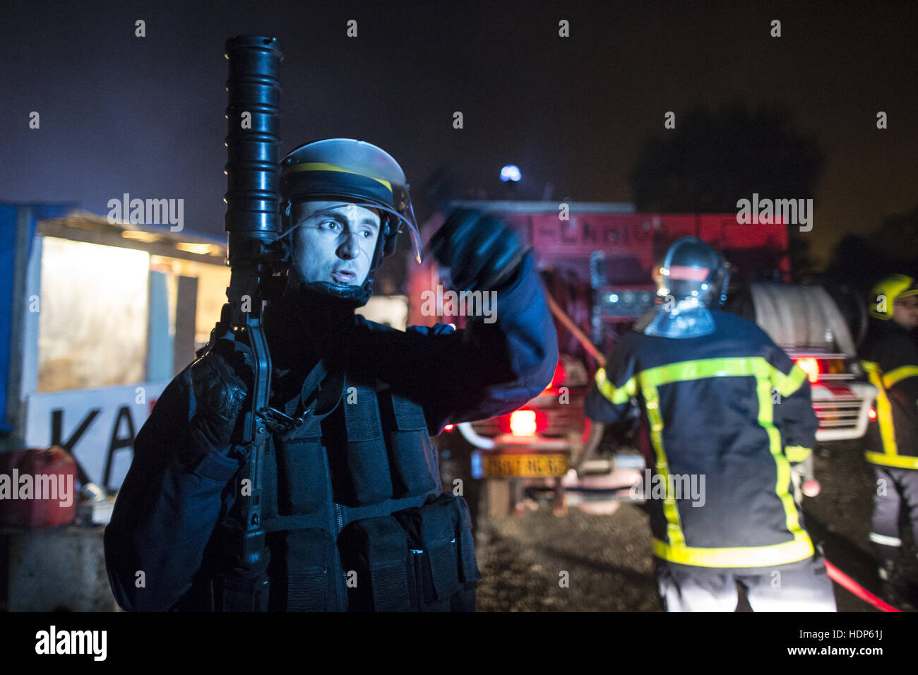 Firefighters in the Calais Jungle putting out fires set alight by ... Firefighters in the Calais Jungle putting out fires set alight by ...