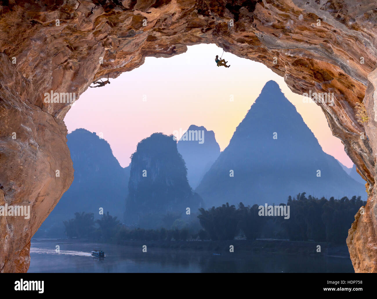 Deep high Cave extreme Climbers on Sunrise in China Mountains Stock ...