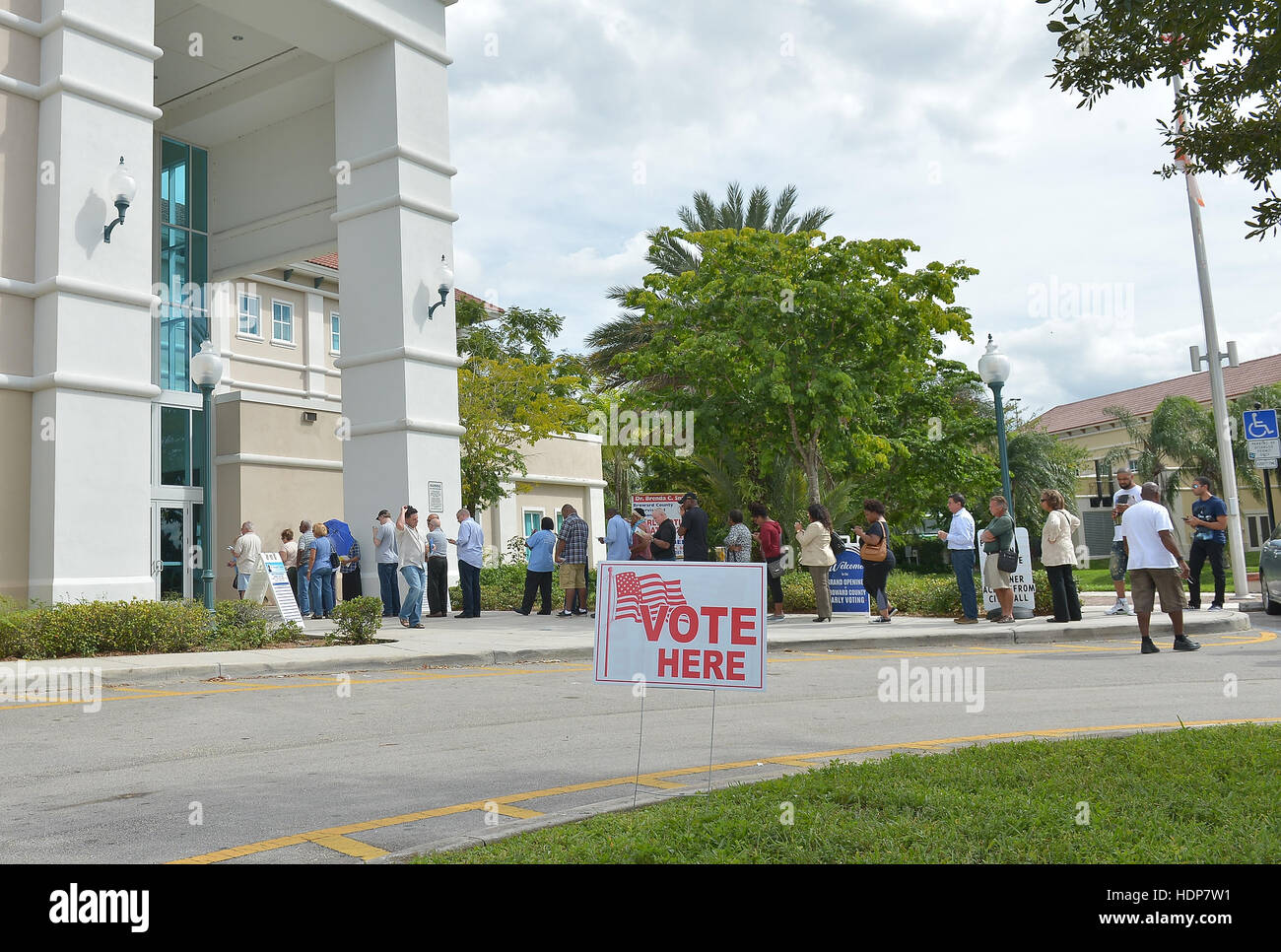Members of the U.S. public line up for their chance to cast a vote at ...