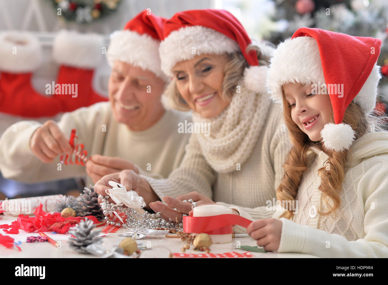 Family preparing for Christmas Stock Photo - Alamy