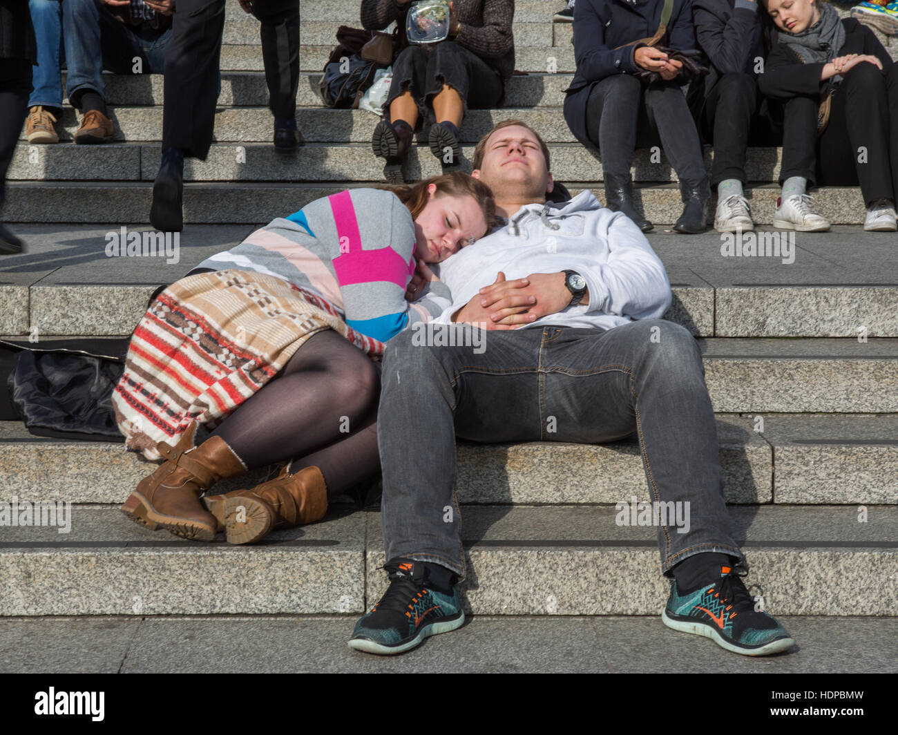 Tourists & Londoners soak up the late October sun in Trafalgar Square ...