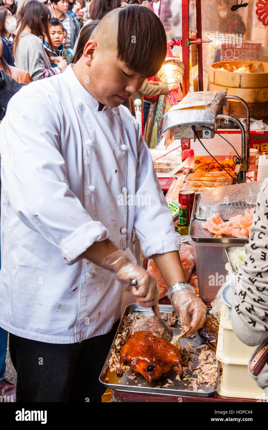 Japan, Kobe, Nankinmachi, Chinatown. Outdoor Chinese food stall with ...