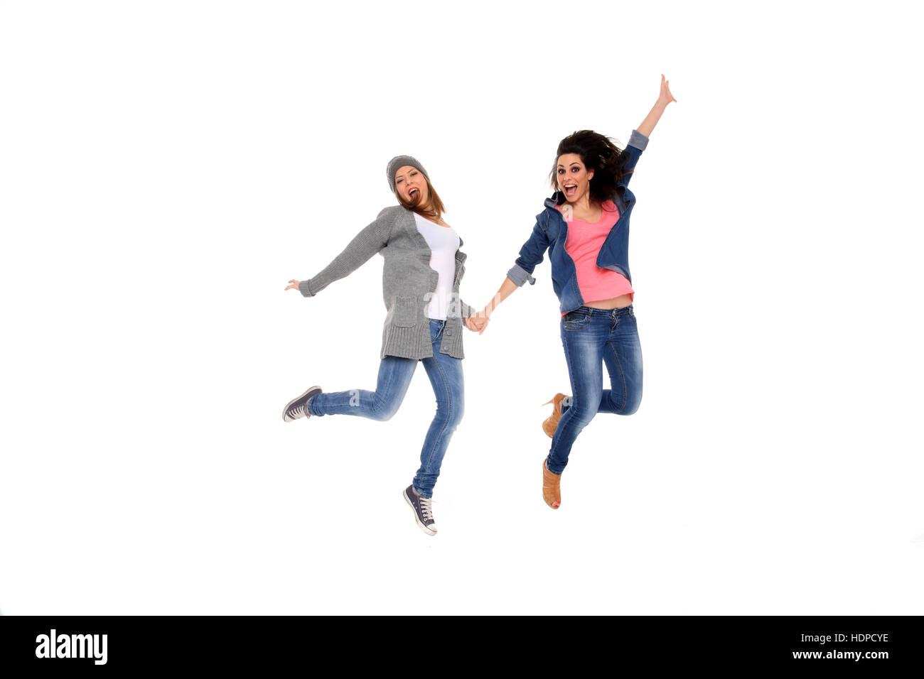 two happy girls in the air isolated on a white background Stock Photo ...