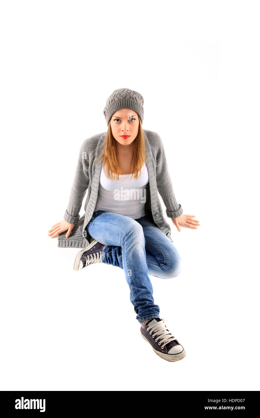 portrait of beautiful girl seating on the floor isolated on a white ...