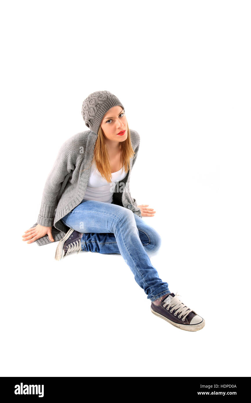 portrait of beautiful girl seating on the floor isolated on a white ...