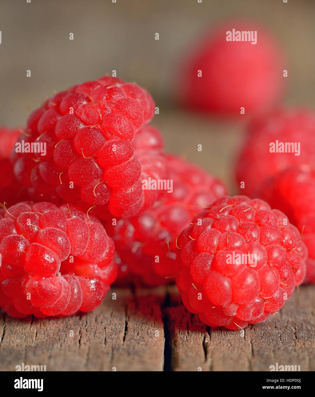 Ripe and fresh raspberry on wooden table Stock Photo - Alamy