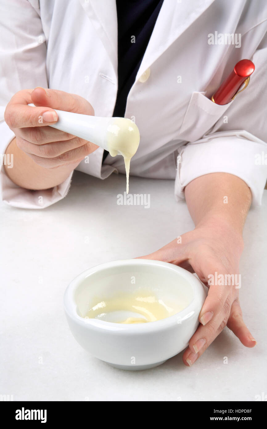 hands mixing ingredients on mortar to make cream Stock Photo - Alamy