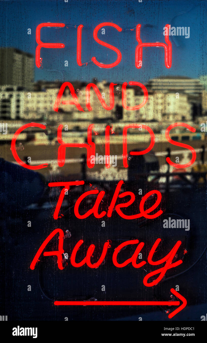 Neon fish and chips take away sign Stock Photo - Alamy