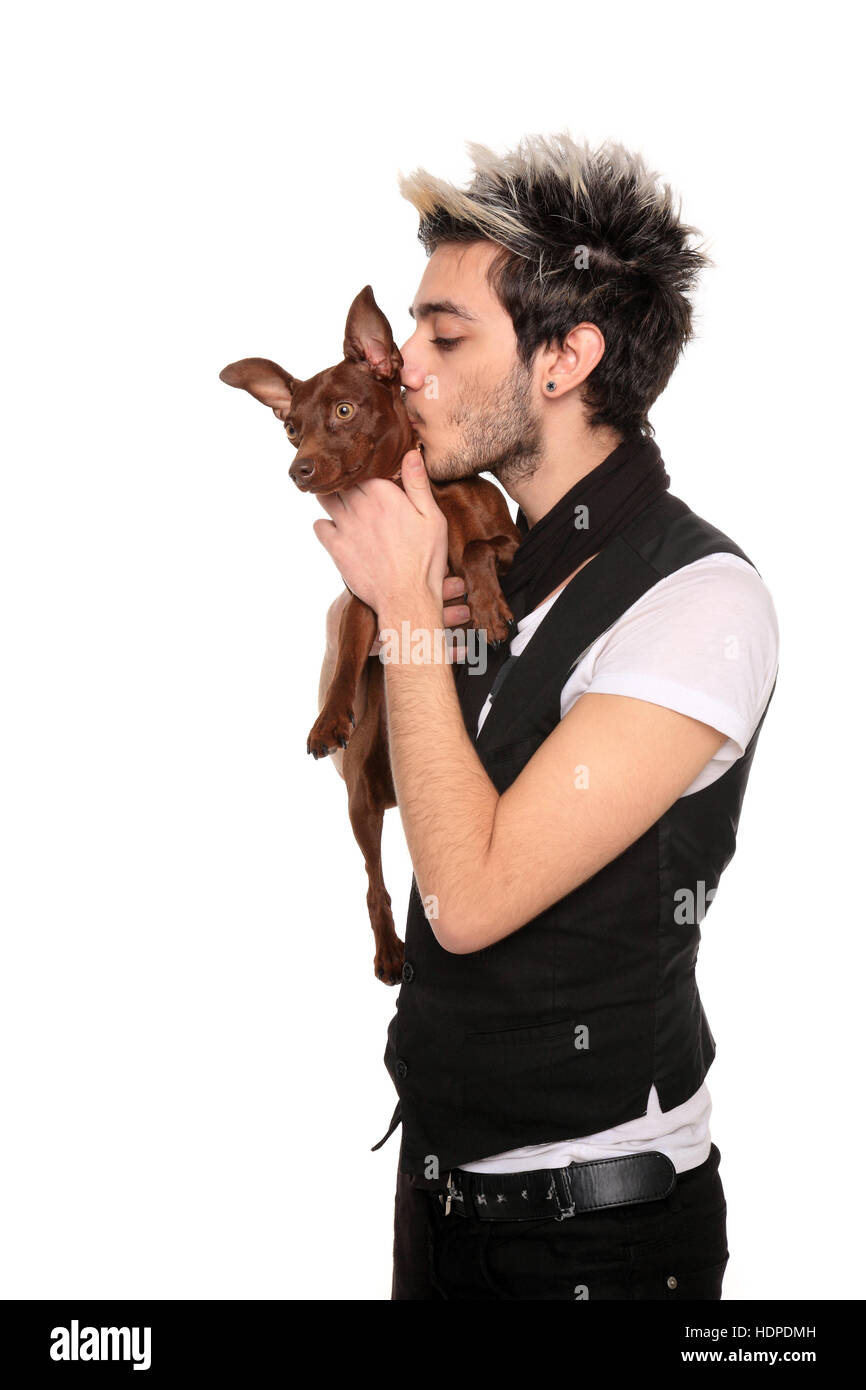 young man posing with pinscher isolated on a white background Stock ...