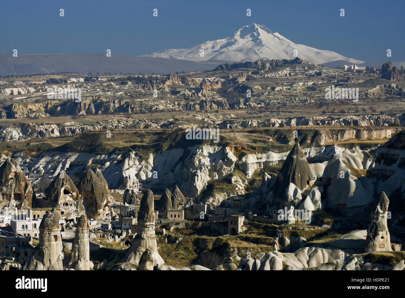 Fairy chimneys and Volcano Erciyes in Cappadocia Stock Photo - Alamy