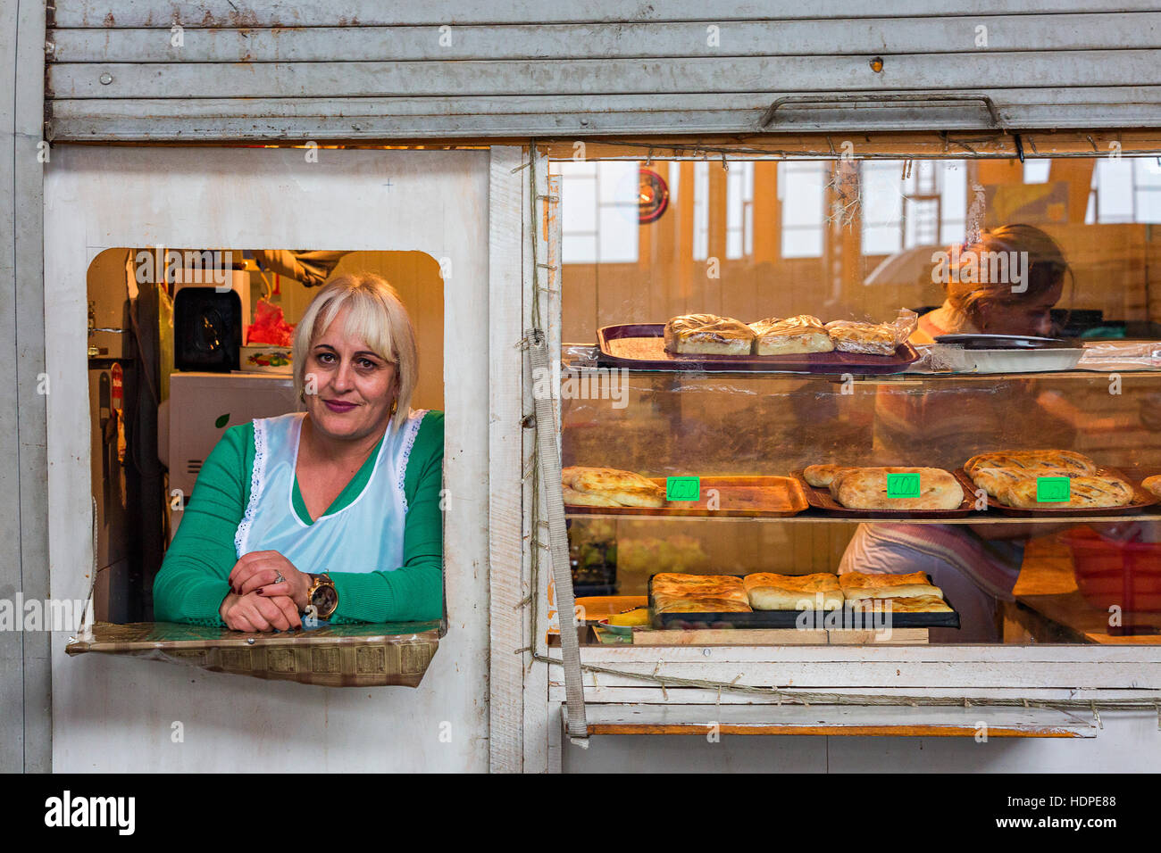 Woman in bakery shop looking through the window in Tbilisi, Georgia ...