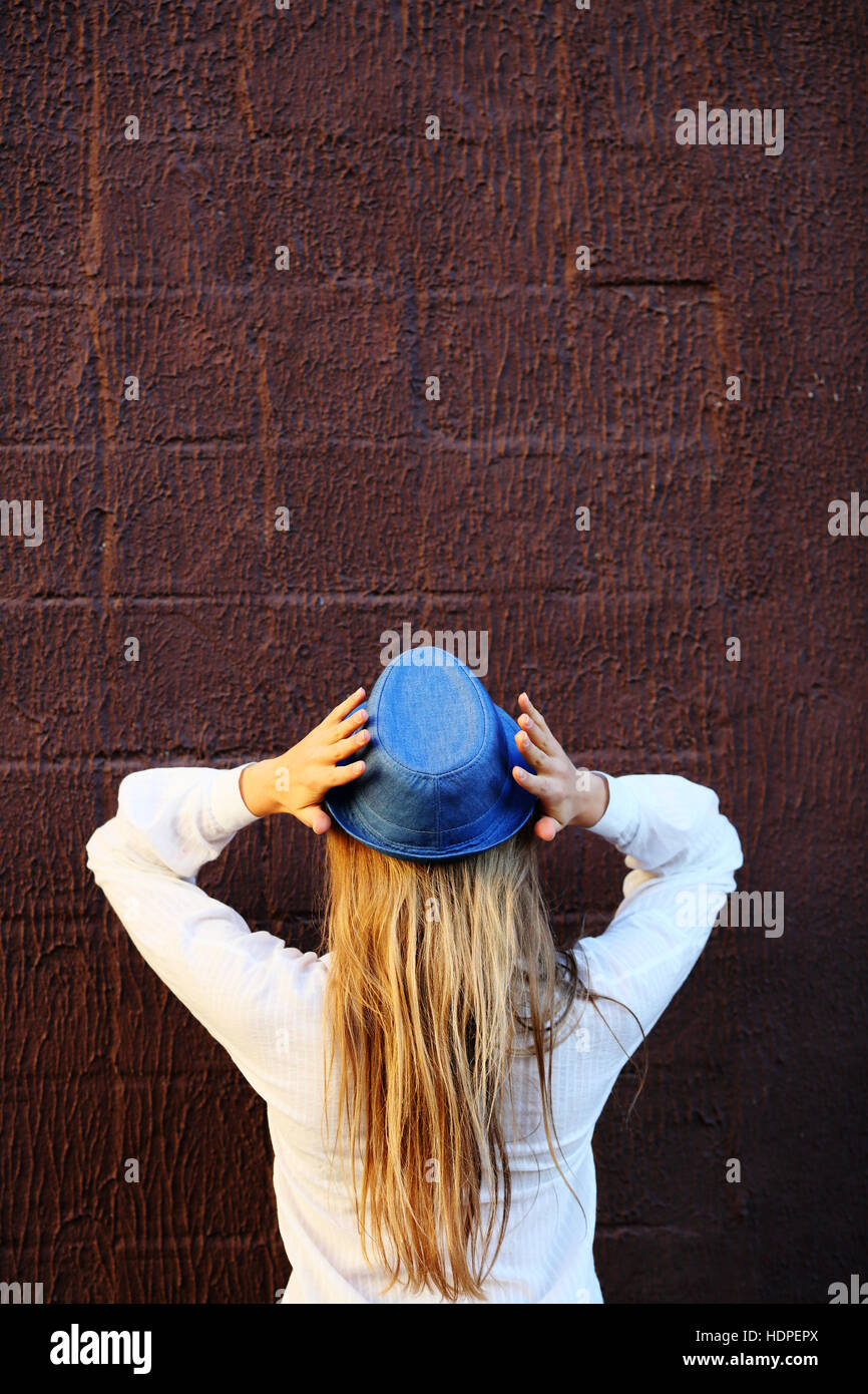 Woman's back holding hat Stock Photo - Alamy