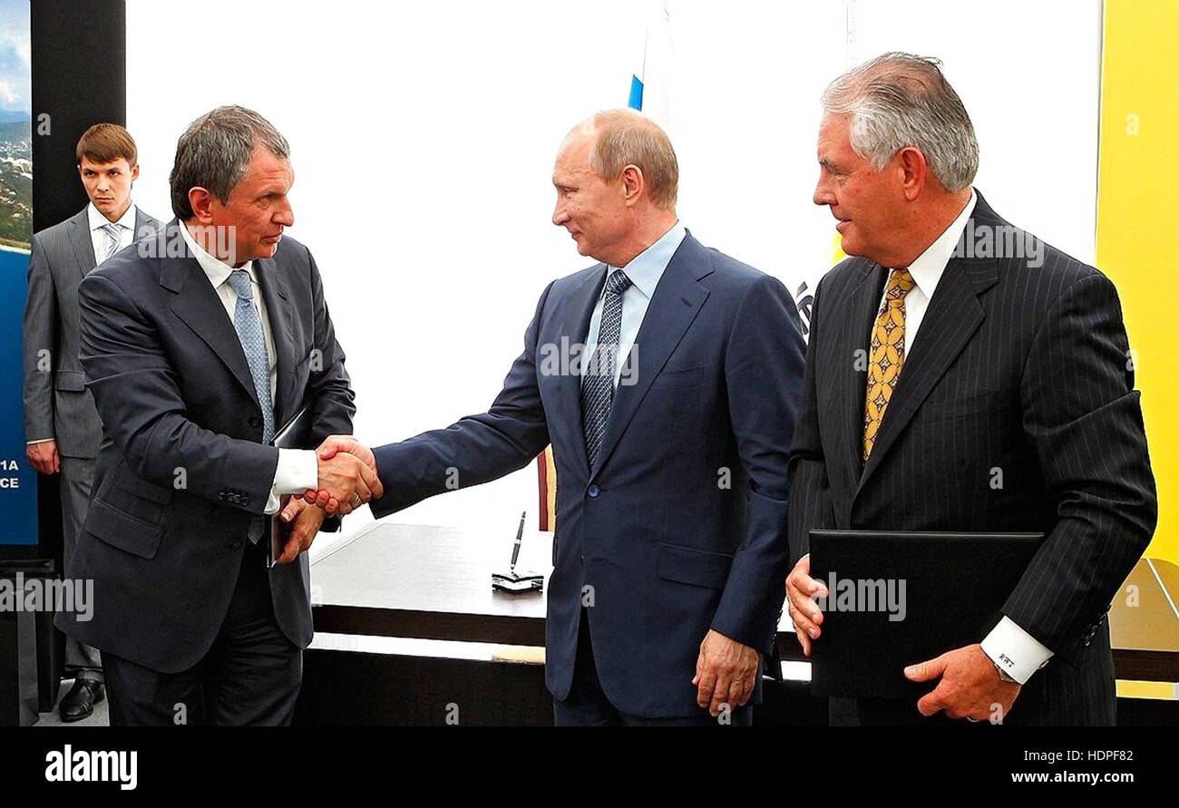 Russian President Vladimir Putin congratulates Rosneft Chairman Igor ...