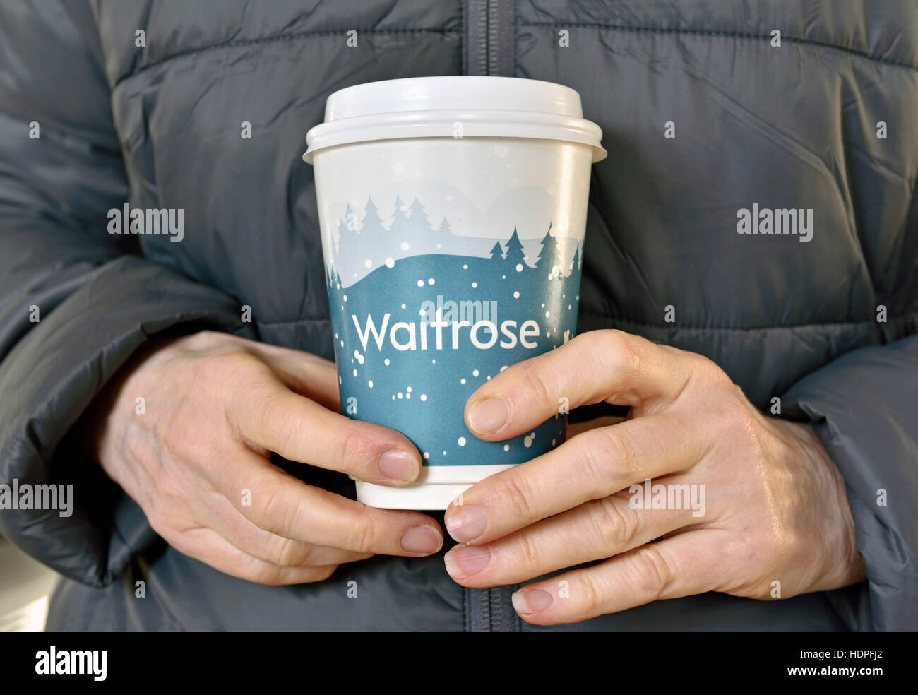 Waitrose take away Christmas disposable coffee cup held in ladies hands ...