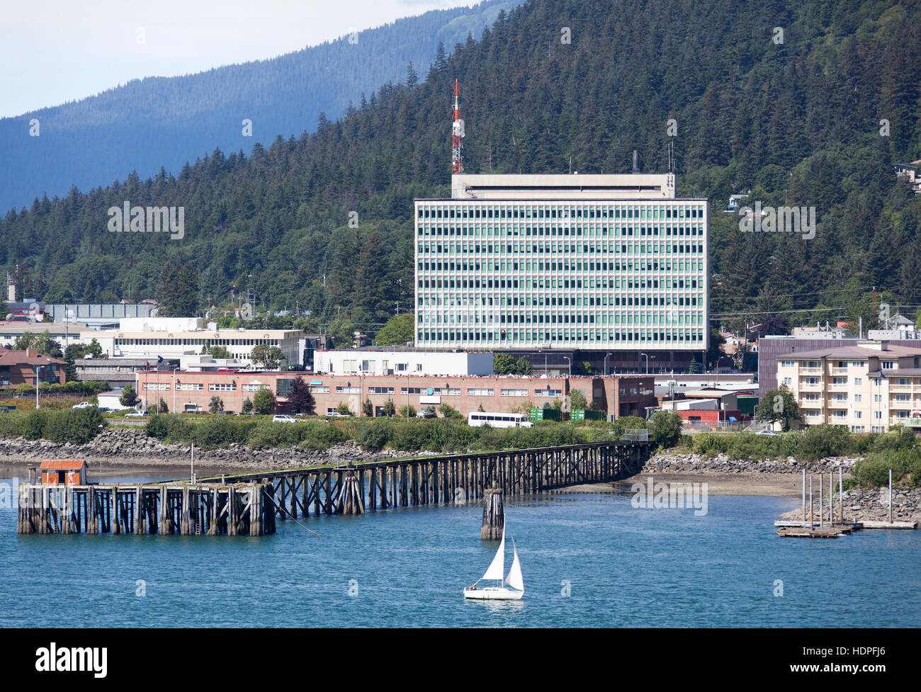 The small boat passing by the government building in Juneau, the ...