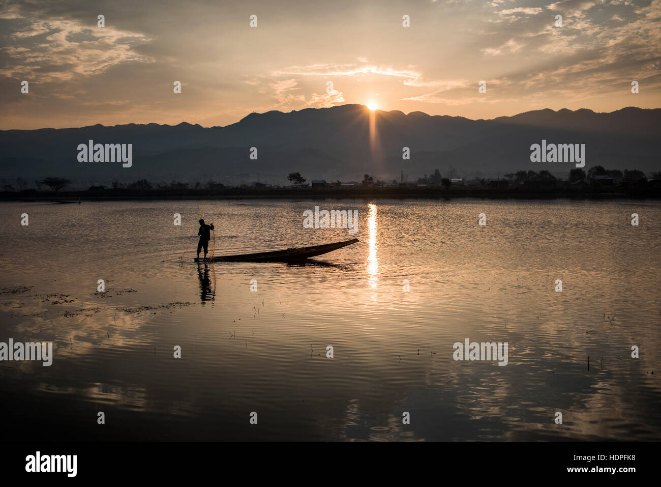 Fisherman working at the Tharzi Pond at sunset time, Nyaungshwe ...