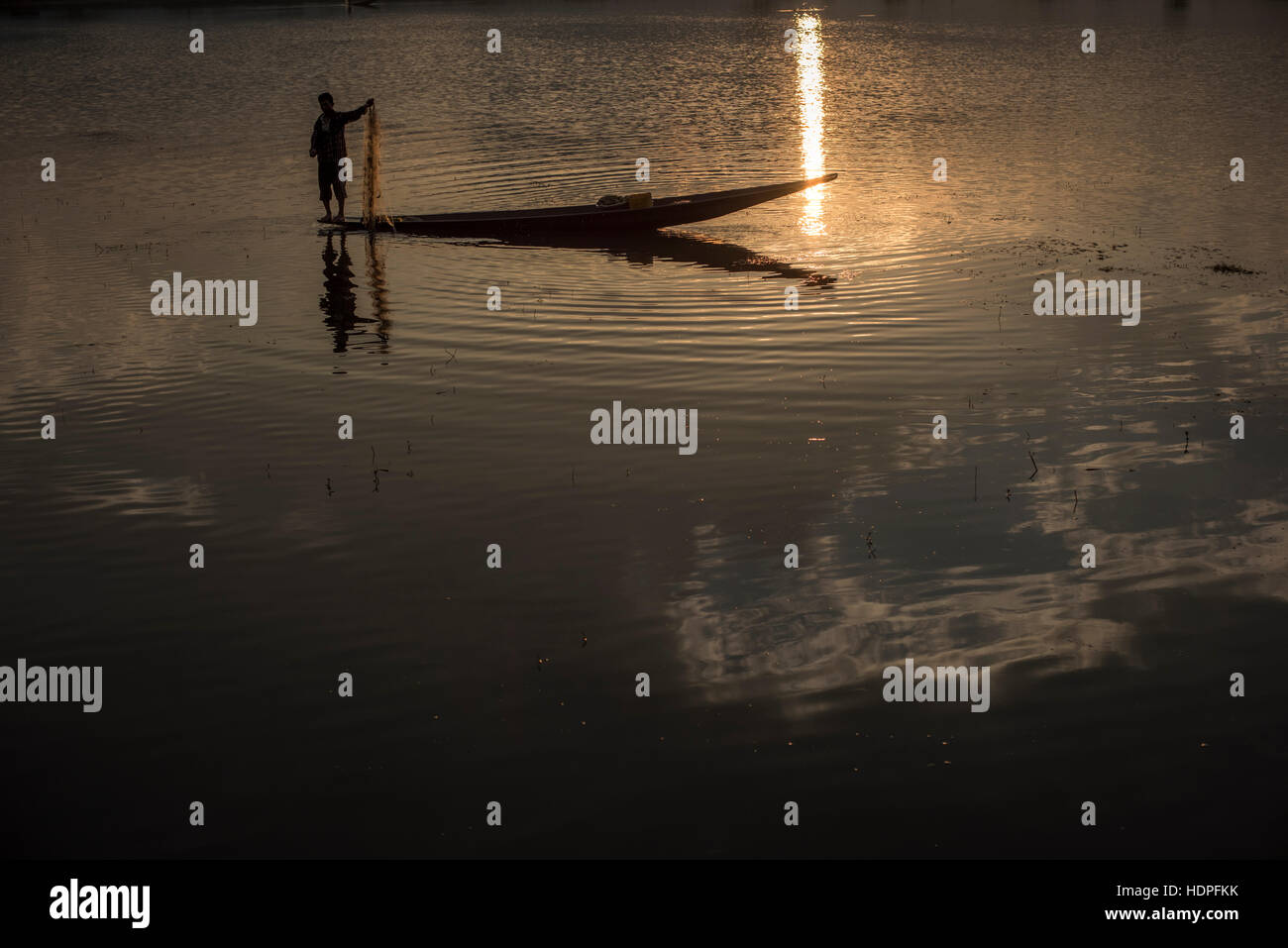 Fisherman working at the Tharzi Pond at sunset time, Nyaungshwe ...