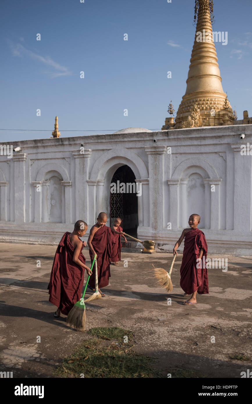 Young buddhist monk sweeping hi-res stock photography and images - Alamy