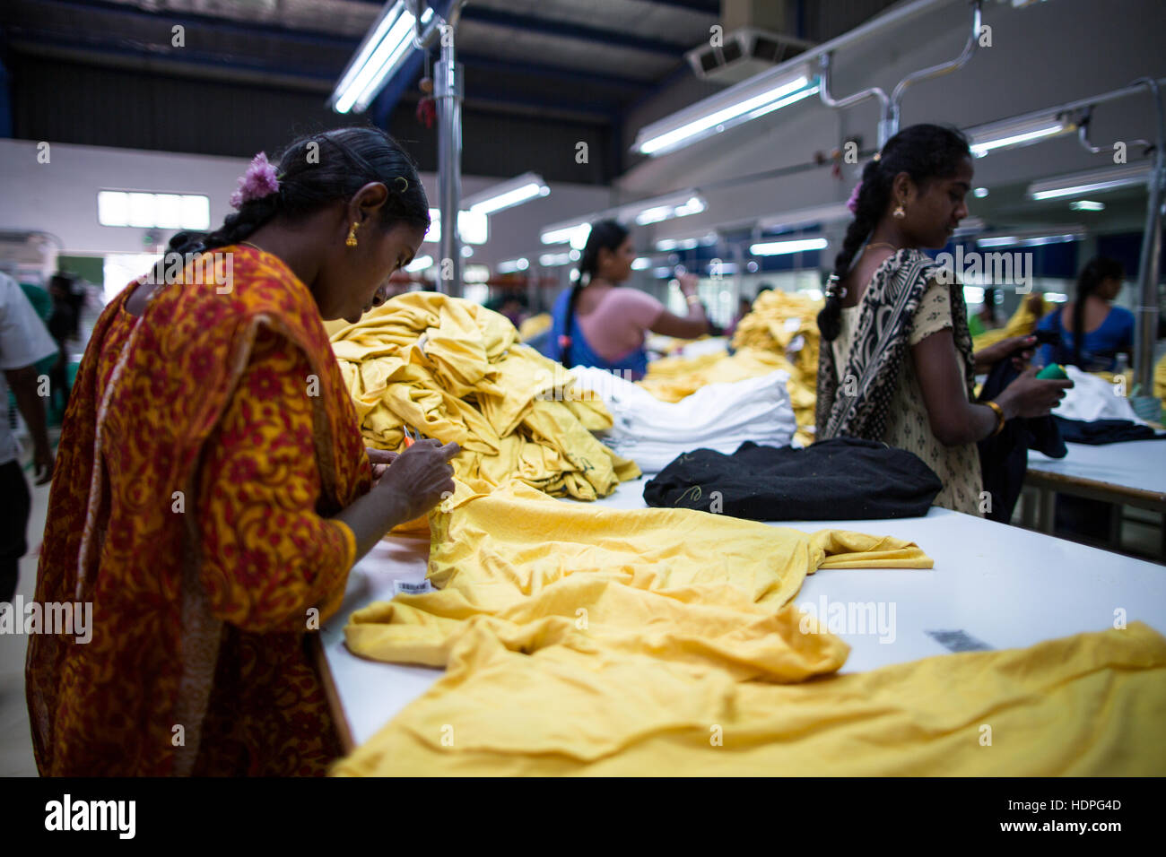 Workers produce t-shirts at a sustainable factory in Tamil Nadu ...