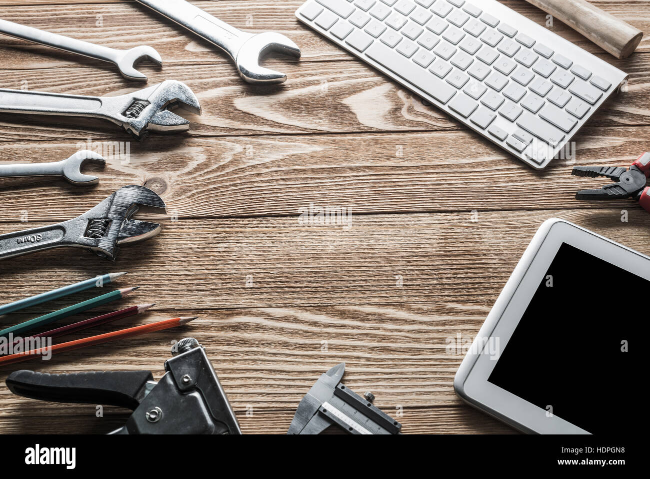 Variety of tools of builder and tablet pc on wooden texture table Stock ...