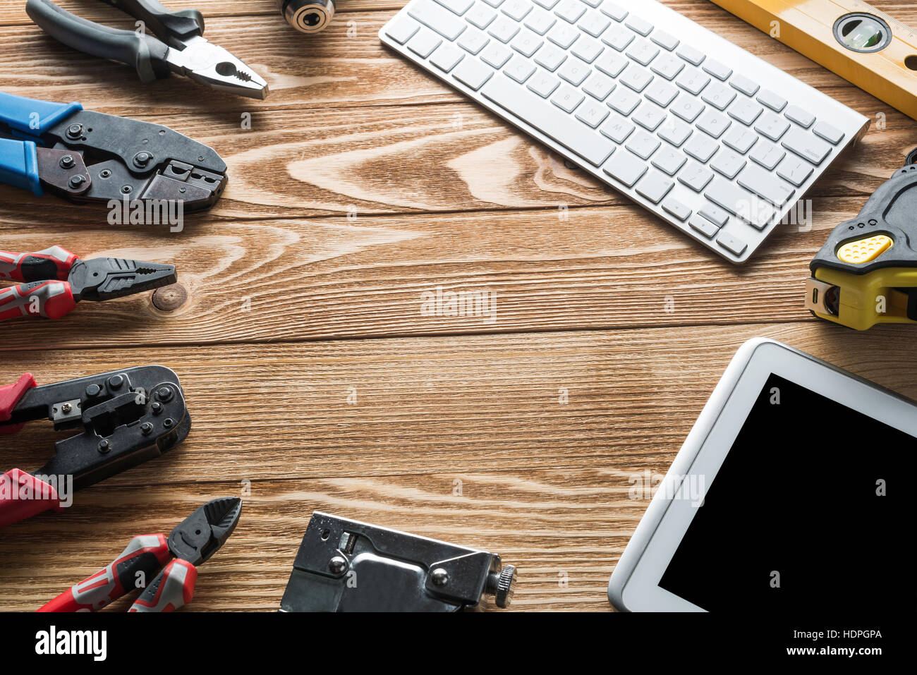 Variety of tools of builder and tablet pc on wooden texture table Stock ...