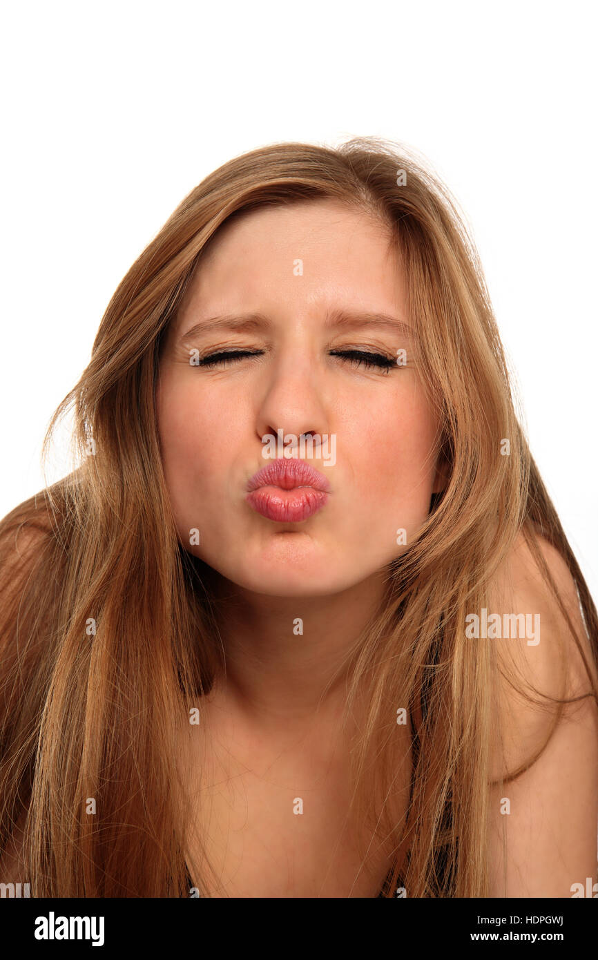 portrait of a beautiful young girl doing expressions isolated on a ...