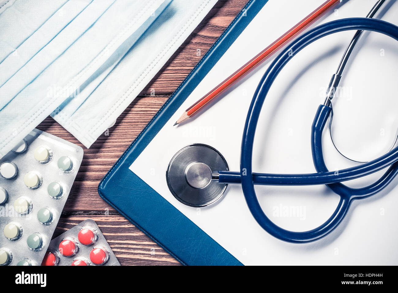 Desk of doctor with medicine things Stock Photo - Alamy