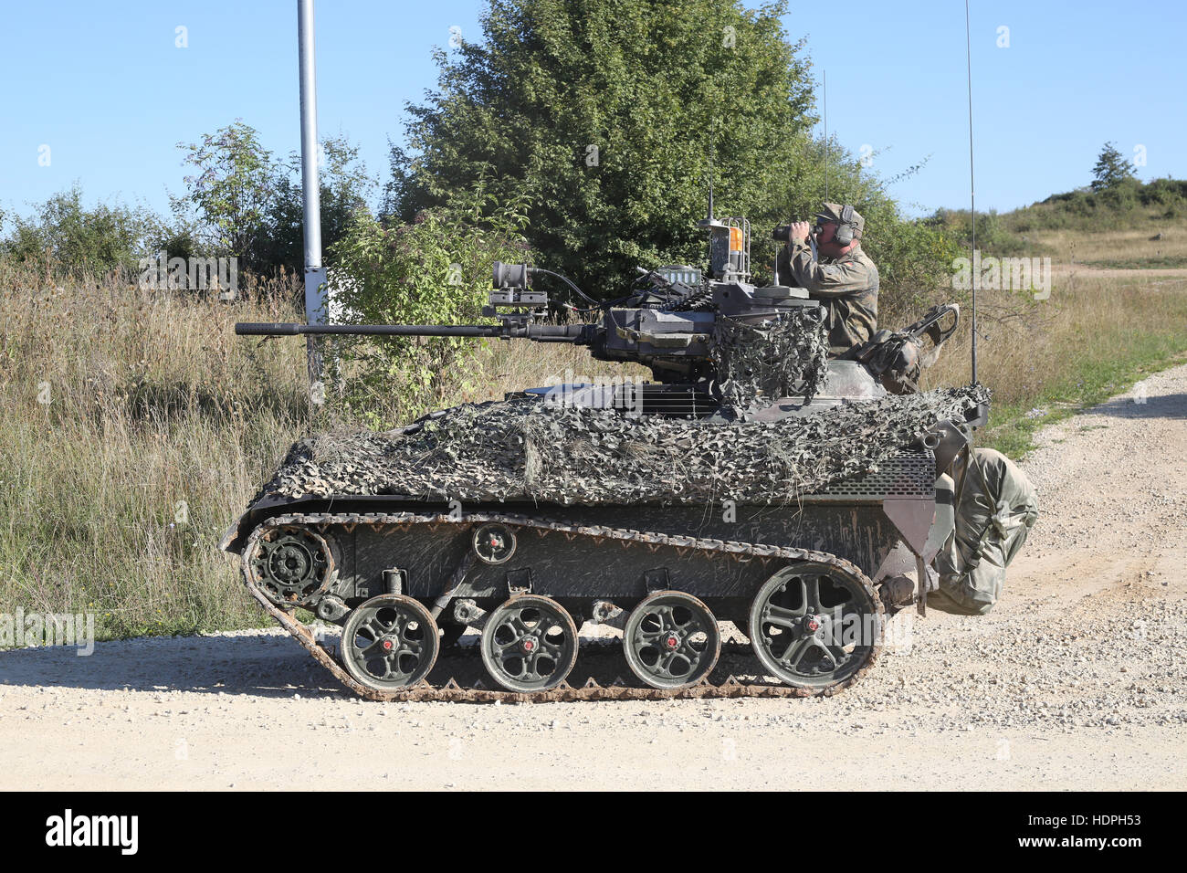 A German soldier provides surveillance from a Wiesel 1A1 MK Armored ...