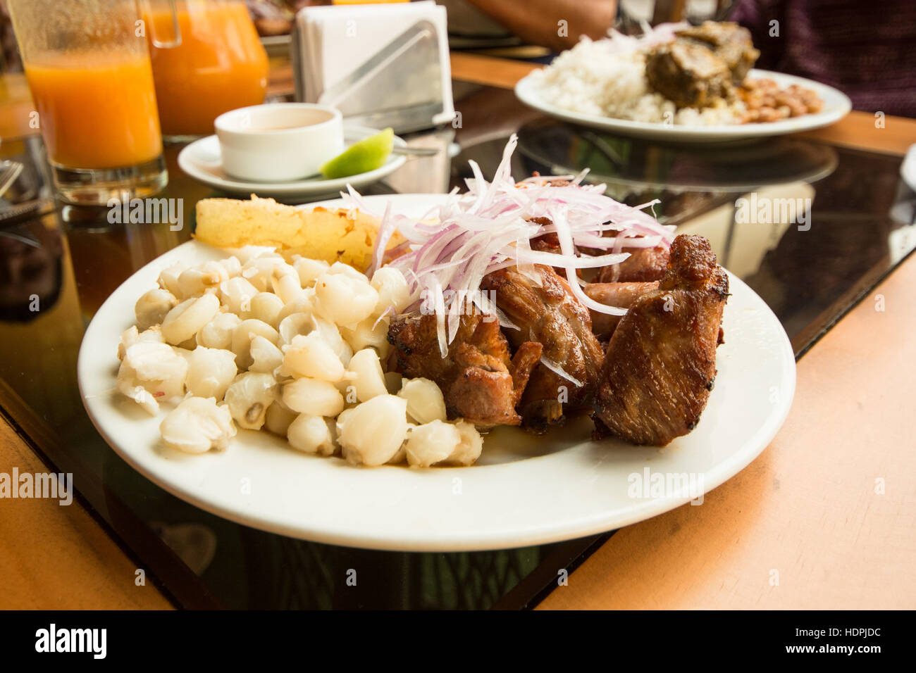 Typical Peruvian dish called Chicharron consisting of deep fried pork ...