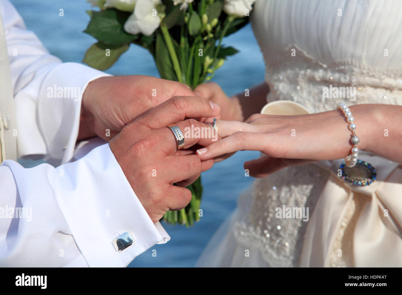 Bride and groom change rings at their wedding Stock Photo - Alamy