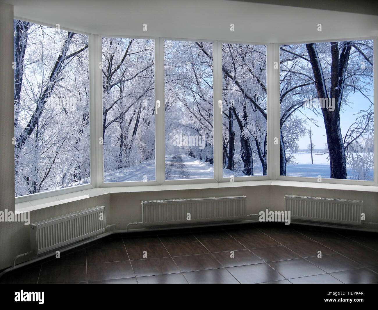 windows overlooking the winter road with beautiful trees in hoarfrost ...