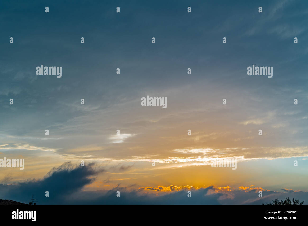 yellow sunset sky with clouds Stock Photo - Alamy