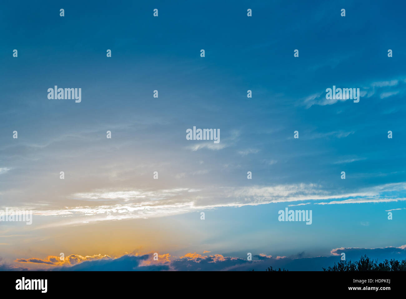 yellow sunset sky with clouds Stock Photo - Alamy